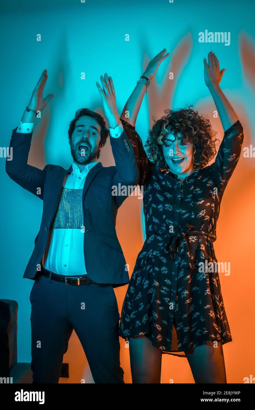A vertical shot of a male and a female dancing macarena Stock Photo - Alamy