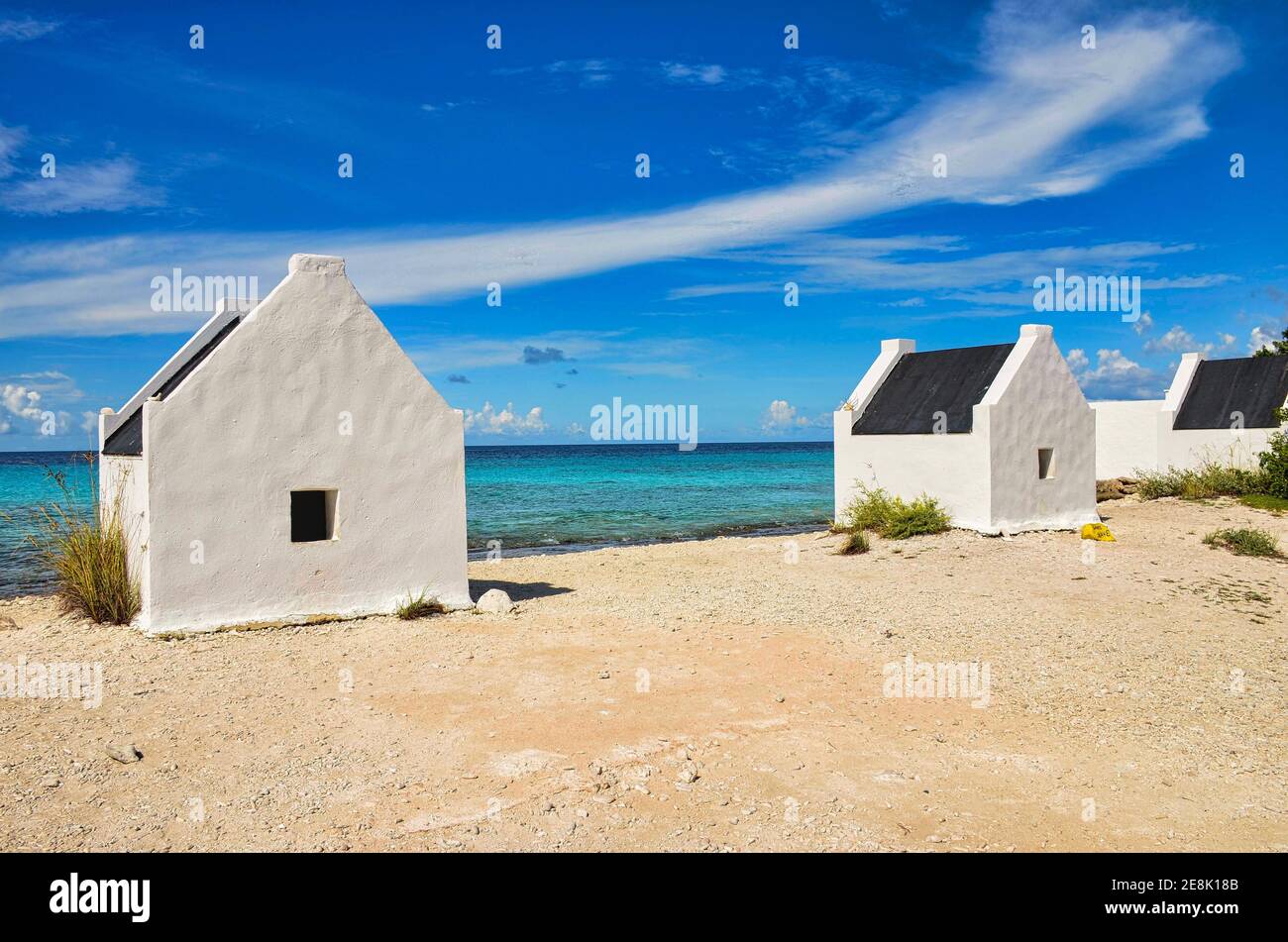 slave houses on the beach in bonaire in the caribbean Stock Photo - Alamy