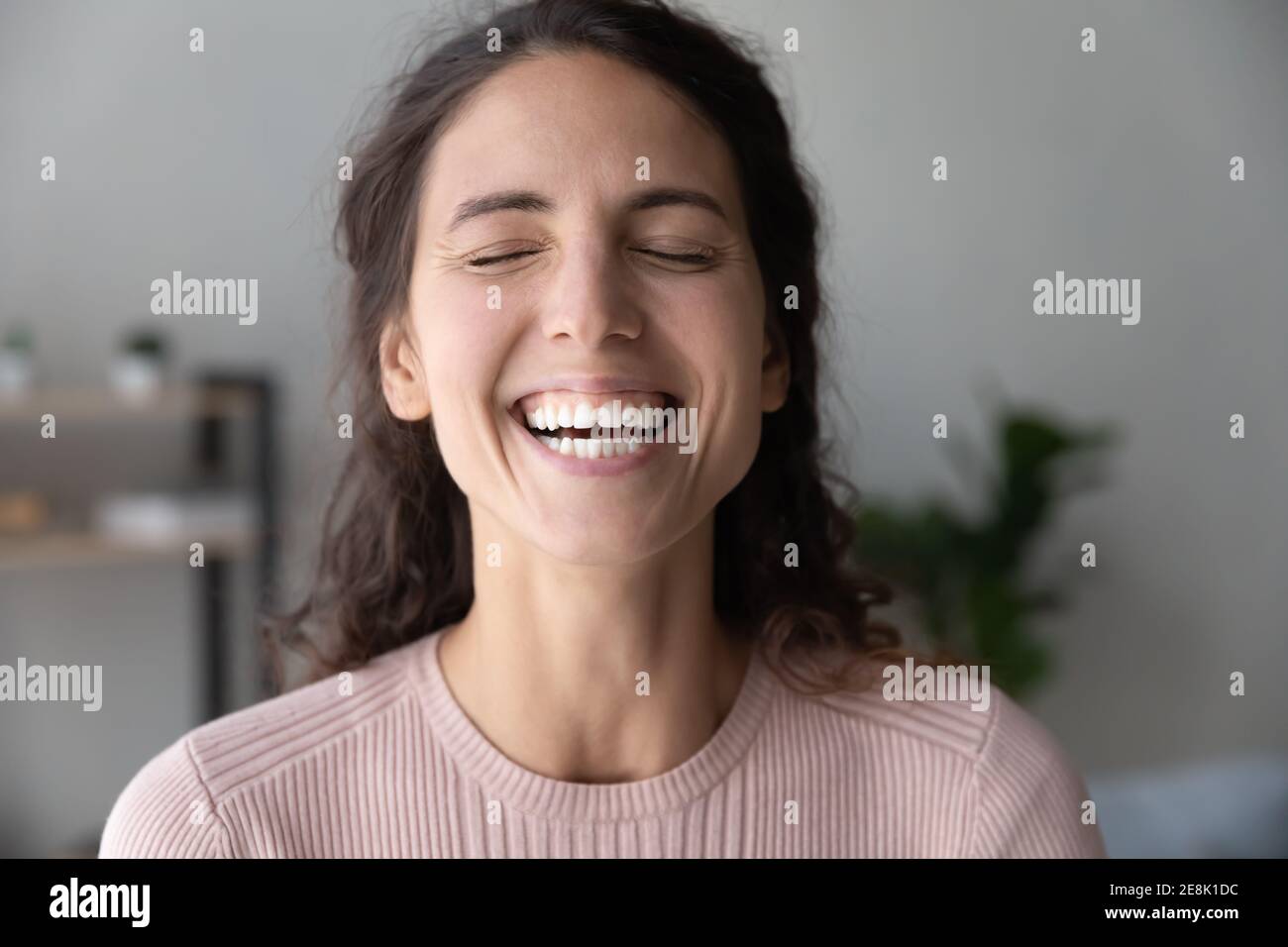 Close up head shot overjoyed young beautiful woman laughing Stock Photo ...