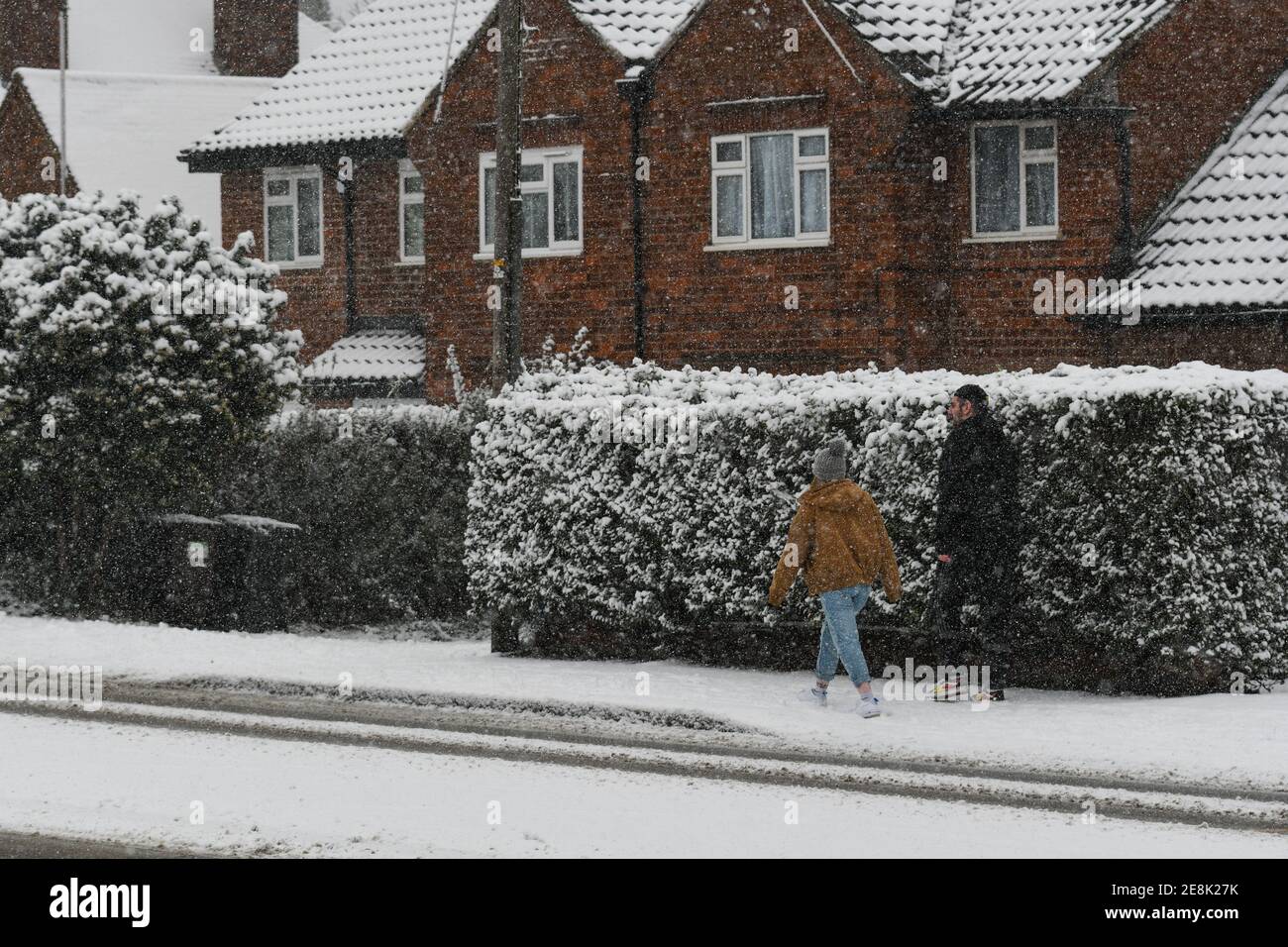 two people walking in the snow Stock Photo - Alamy
