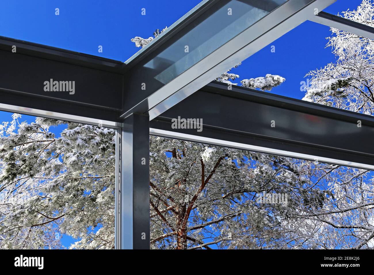 Interior view of a modern conservatory (winter garden) in an alpine ...