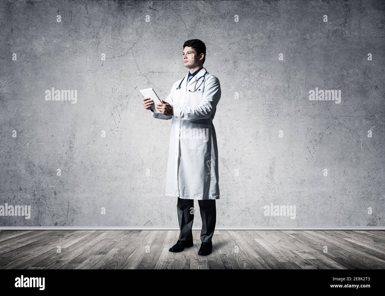 Doctor with tablet Stock Photo - Alamy