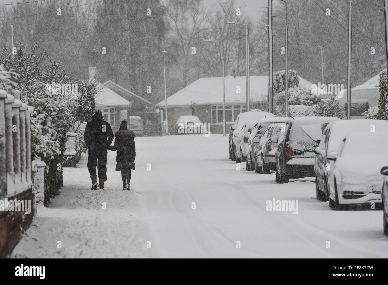 two people walking in the snow Stock Photo - Alamy