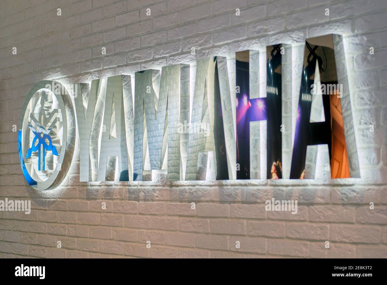 Yamaha brand inscription and logo on the wall of a musical instrument ...
