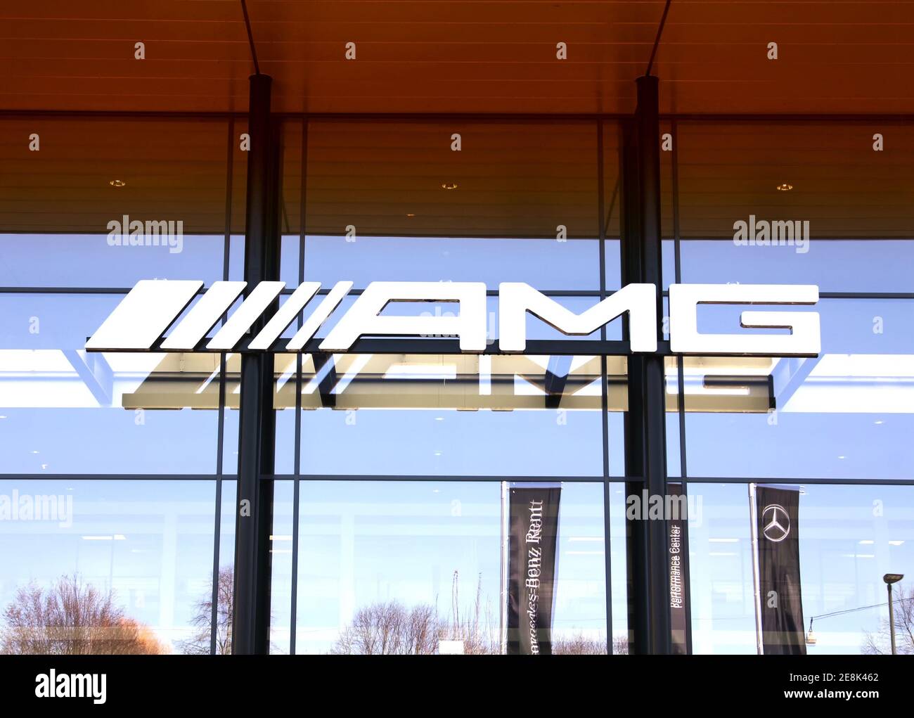 Mercedes Benz AMG logo close up on a dealer building. Mercedes-Benz is ...