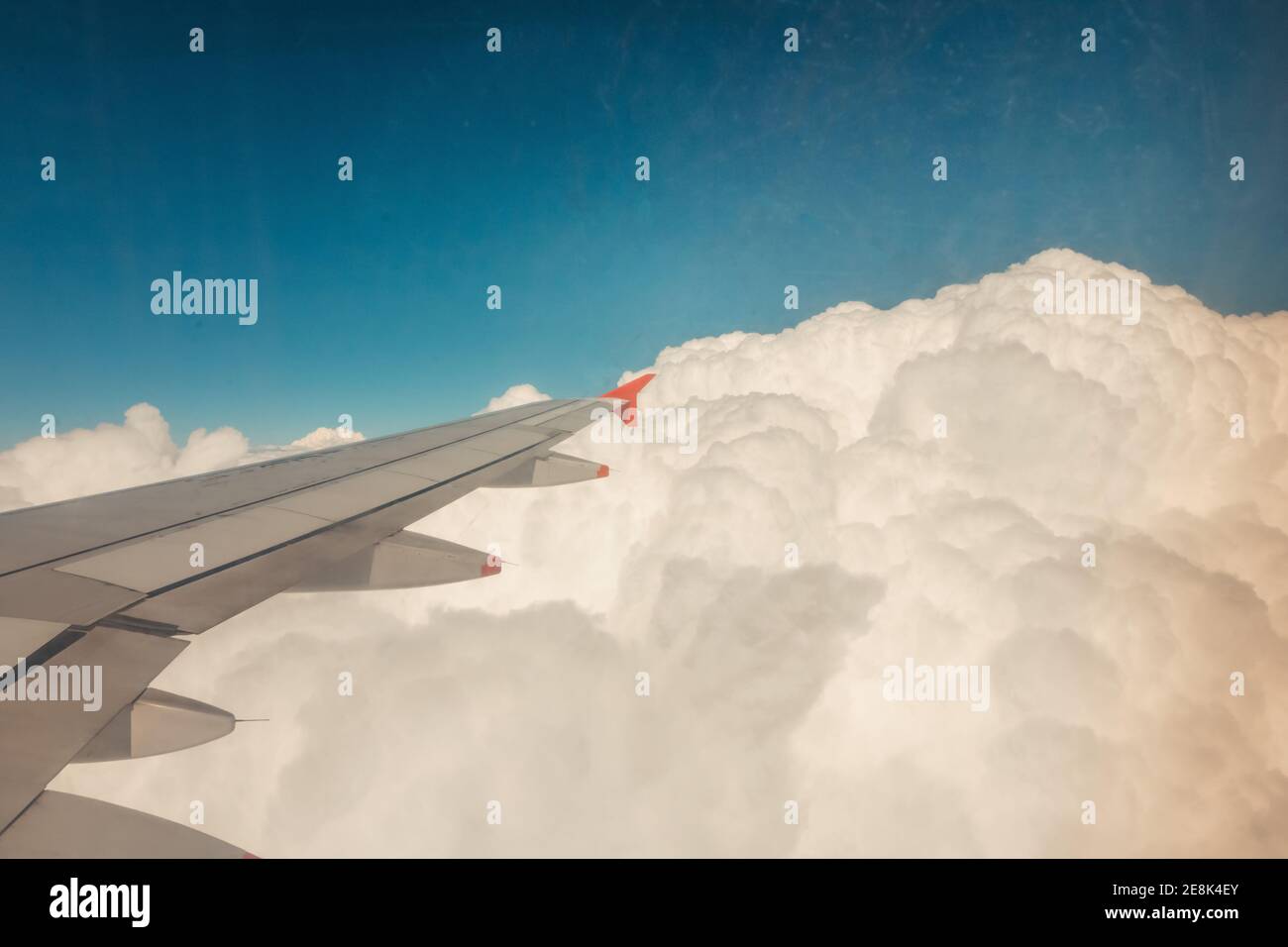 Travel view window plane with mountains and clouds at background Stock ...