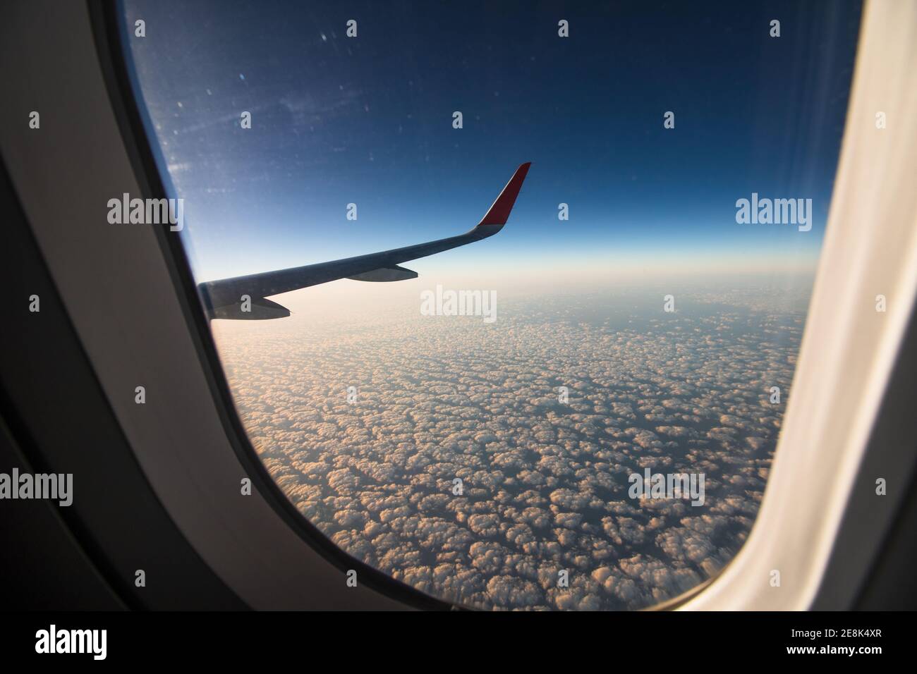 Travel view window plane with mountains and clouds at background Stock ...