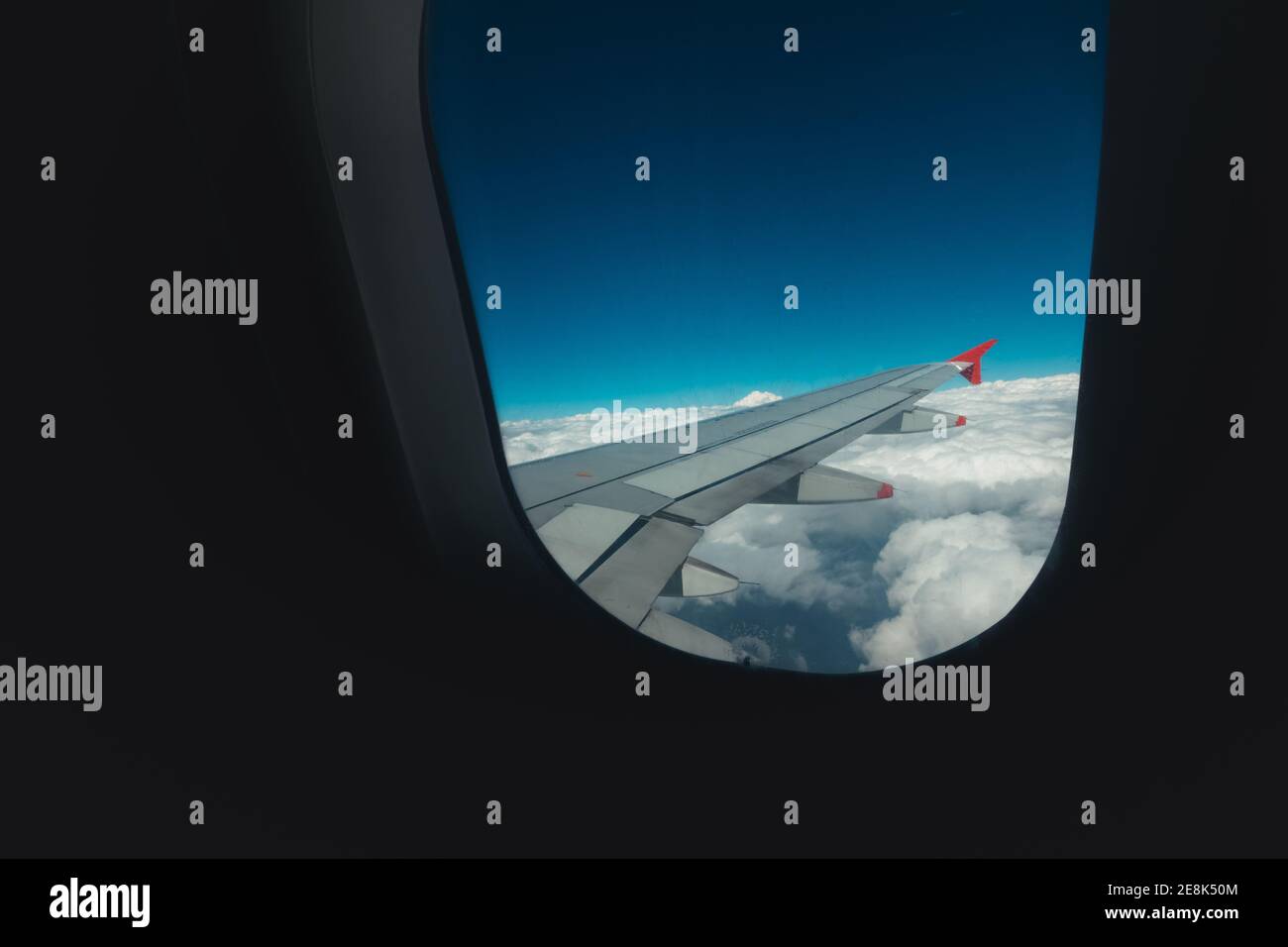 Travel view window plane with mountains and clouds at background Stock ...