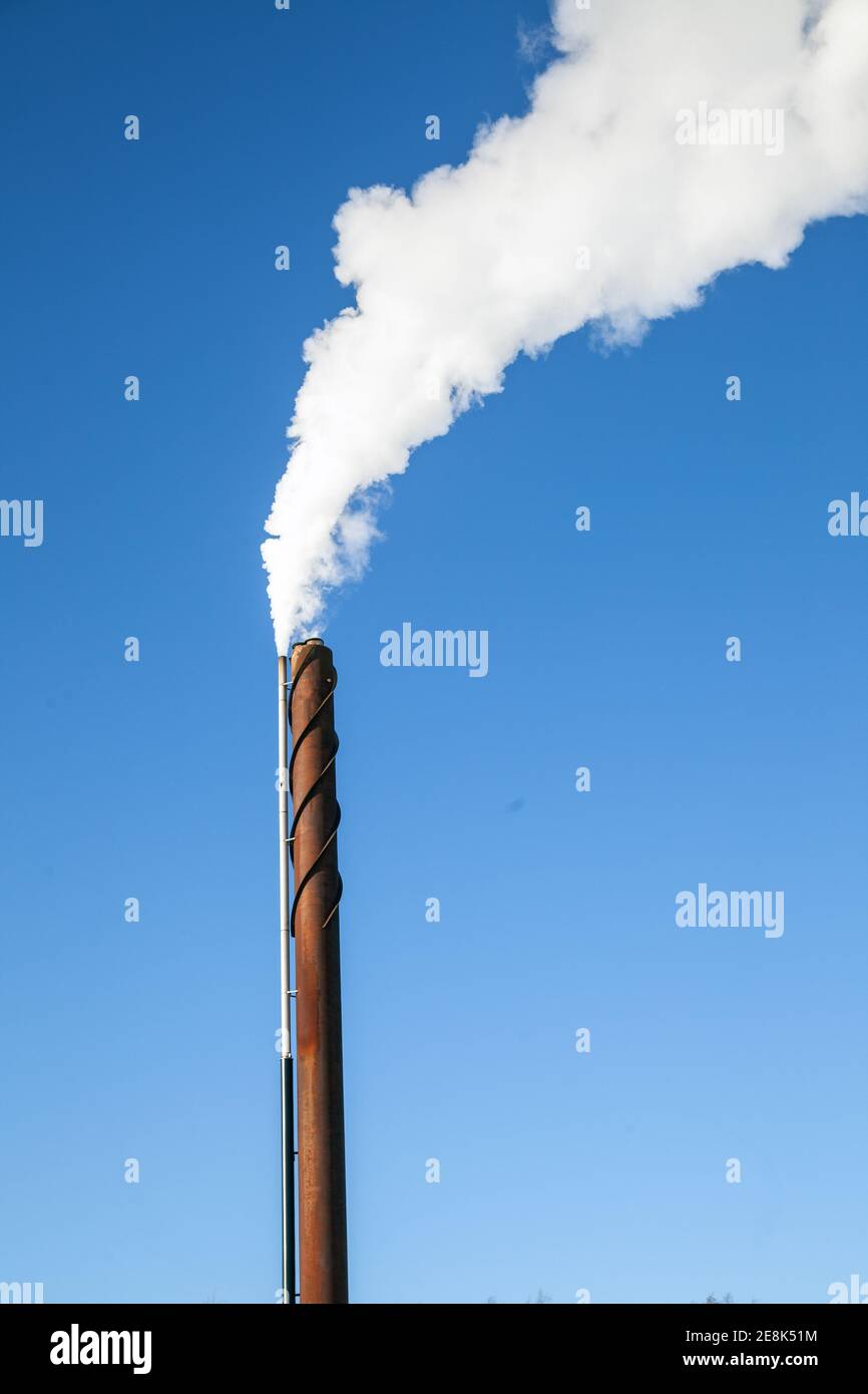 Smoke rises from an industrial chimney Photo: Bo Arrhed Stock Photo - Alamy