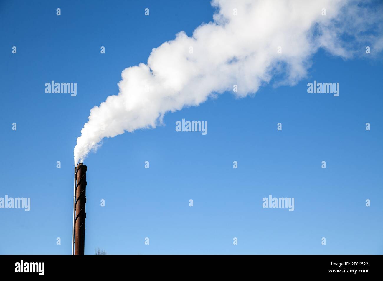 Smoke rises from an industrial chimney Photo: Bo Arrhed Stock Photo - Alamy