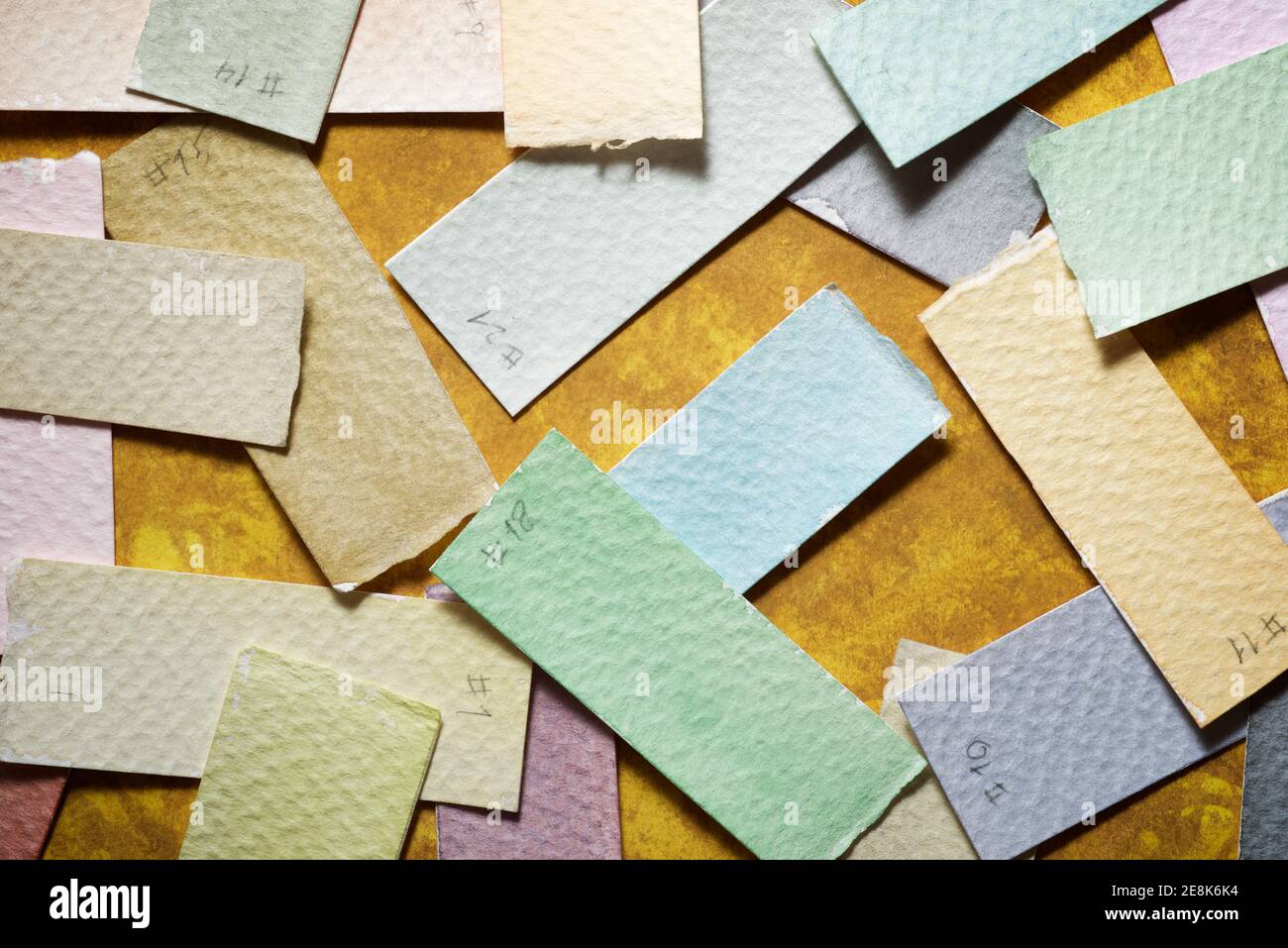 Watercolor test cards on a painted paper Stock Photo - Alamy