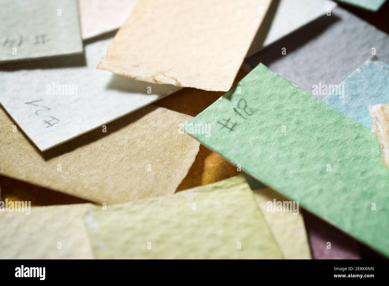 Watercolor test cards on a painted paper Stock Photo - Alamy