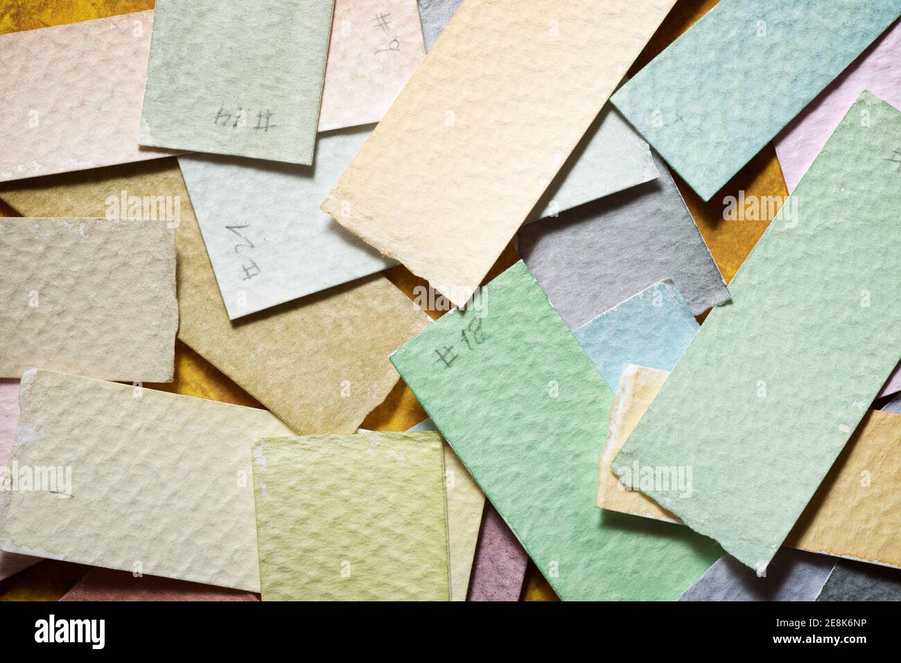 Watercolor test cards on a painted paper Stock Photo - Alamy