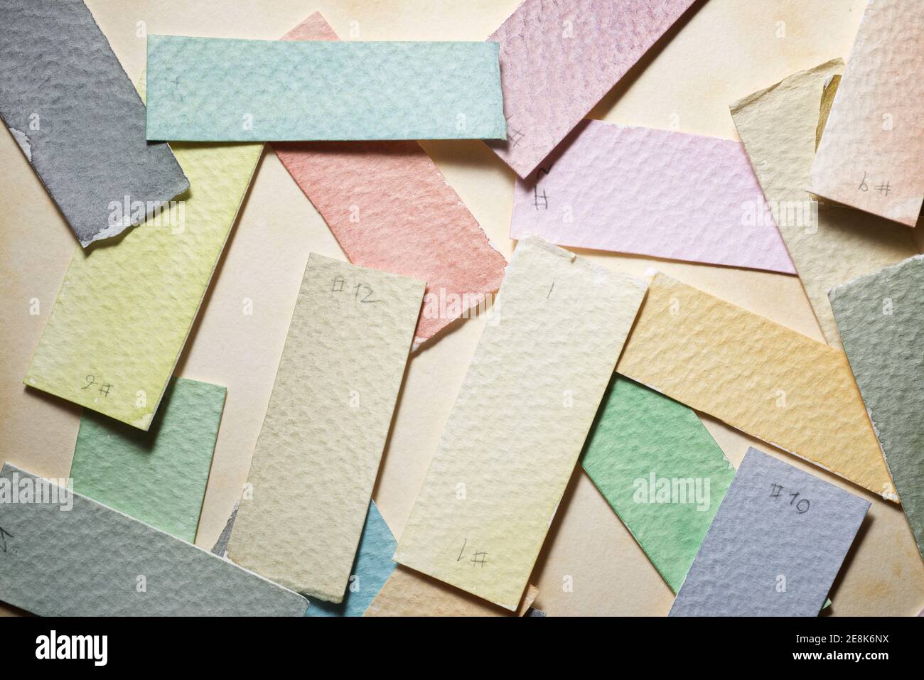 Watercolor test cards on a painted paper Stock Photo - Alamy