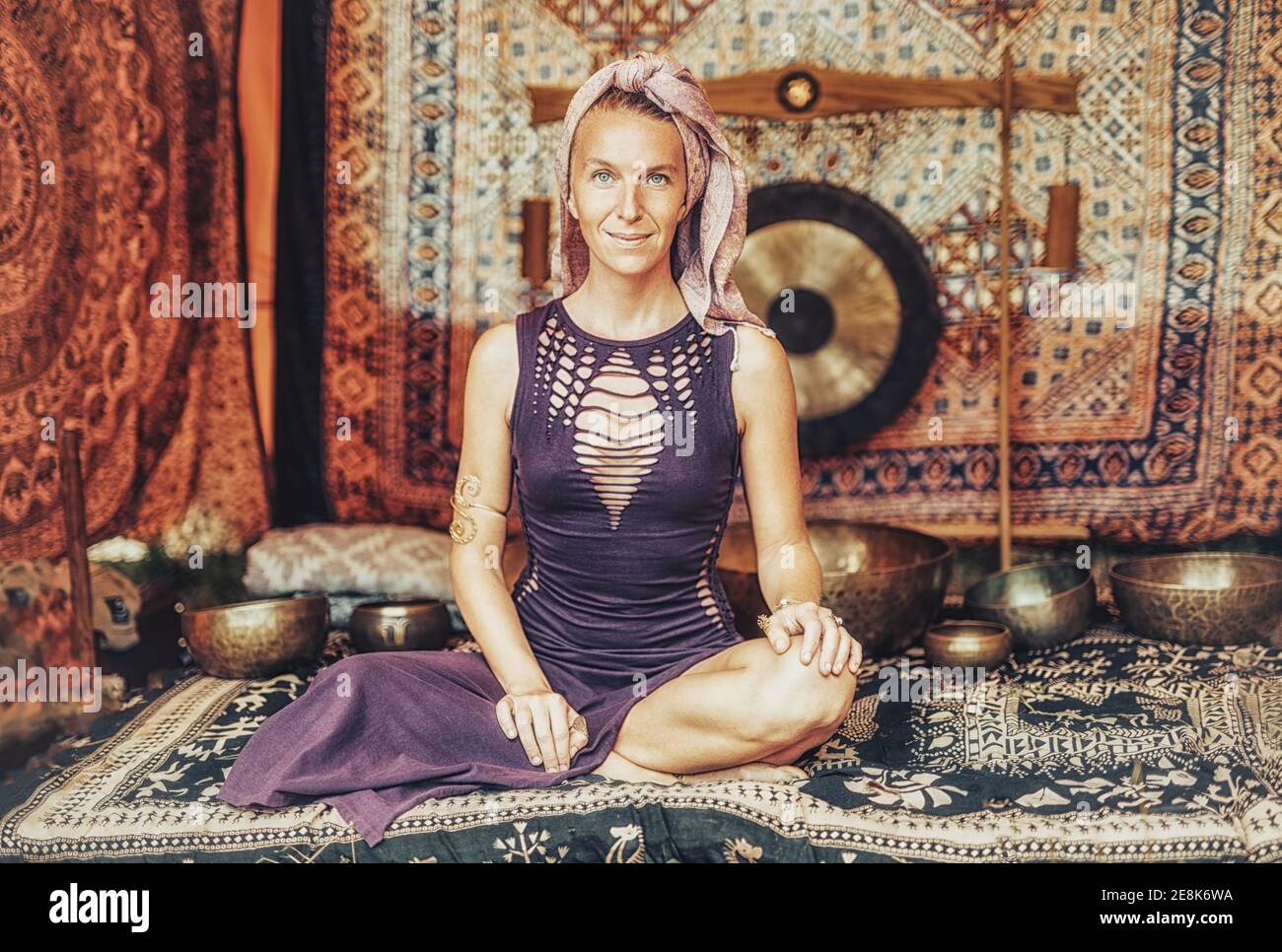 Spiritual girl immersed in meditative sounds of tibetian bowl Stock ...
