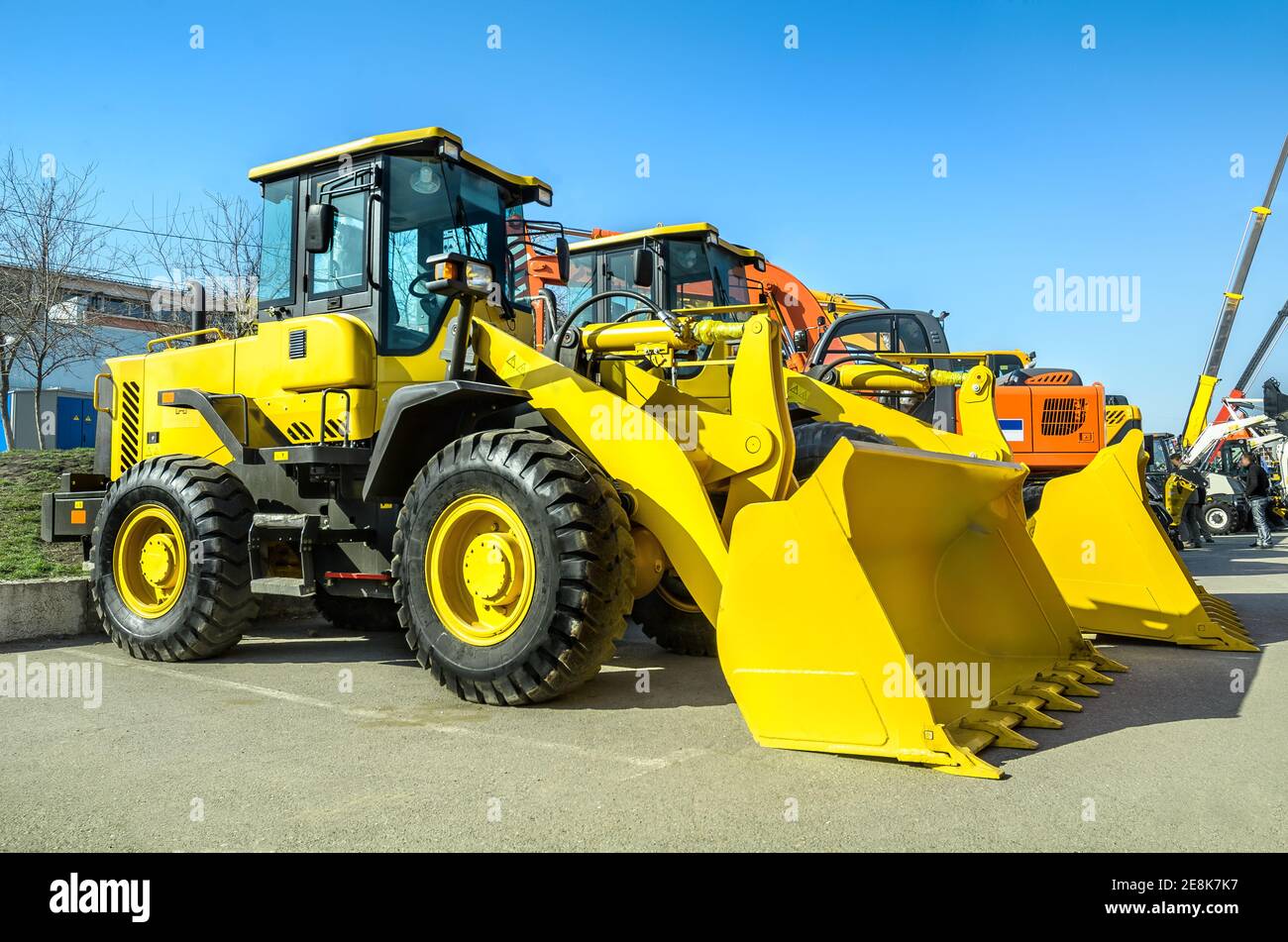 wheel loader isolated on white background Stock Photo - Alamy