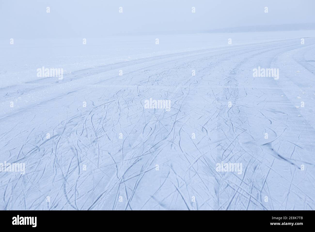 Empty ice skating track at the frozen lake Stock Photo - Alamy
