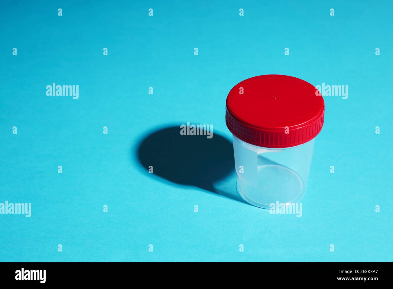 medical sample container for clinical test. empty bottle with red cup ...