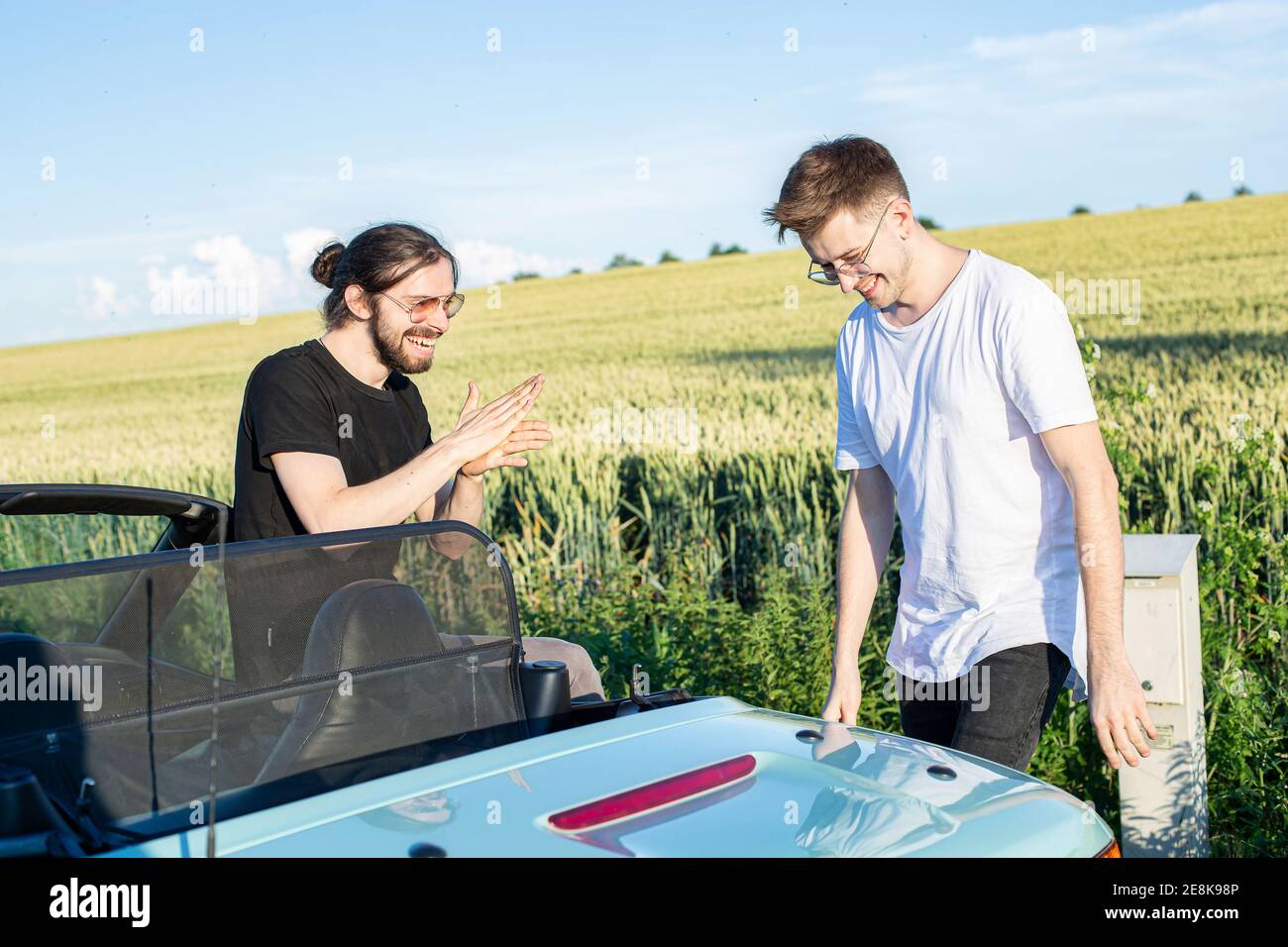 White european boy with sky behind part of the car in front Stock Photo ...