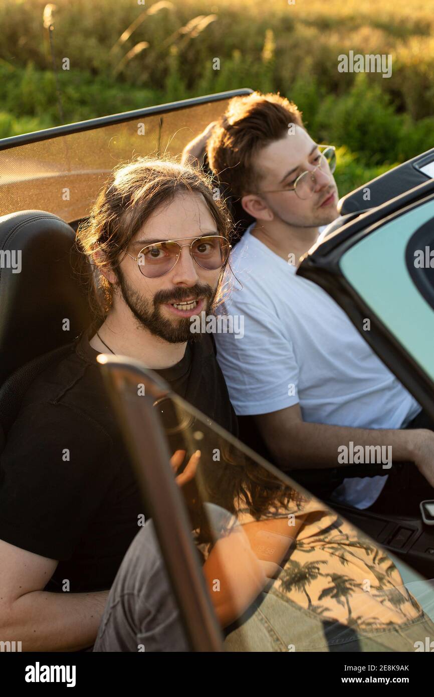 Young white models men in the car Stock Photo - Alamy