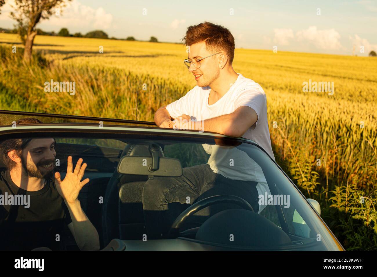 Young white european men in the car talking Stock Photo - Alamy