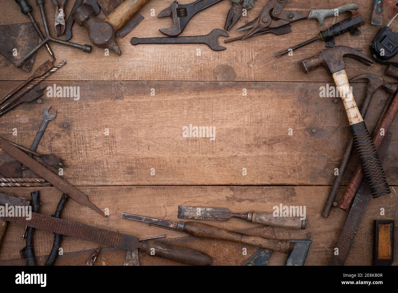Collection of antique woodworking handtools on a rough workbench old ...