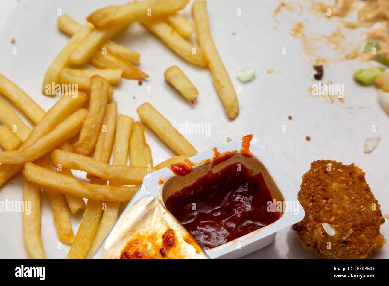 left over takeaway fries and dip on a plate Stock Photo - Alamy