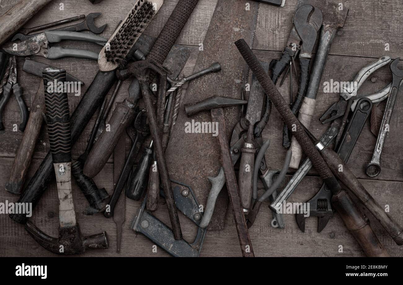Collection of old woodworking handtools on a rough workbench wooden ...
