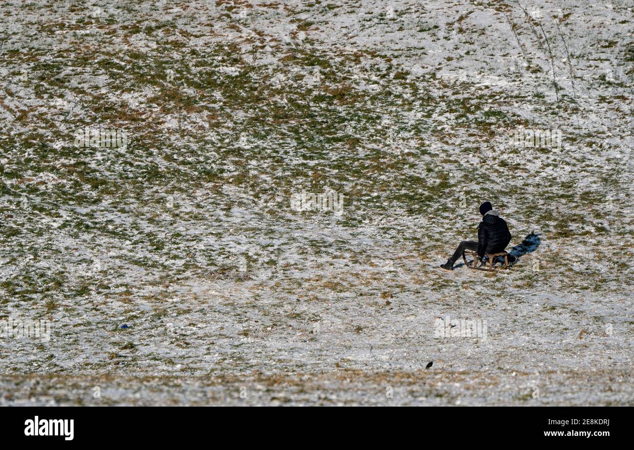 Bungsberg, Germany. 31st Jan, 2021. A tobogganist descends the ...