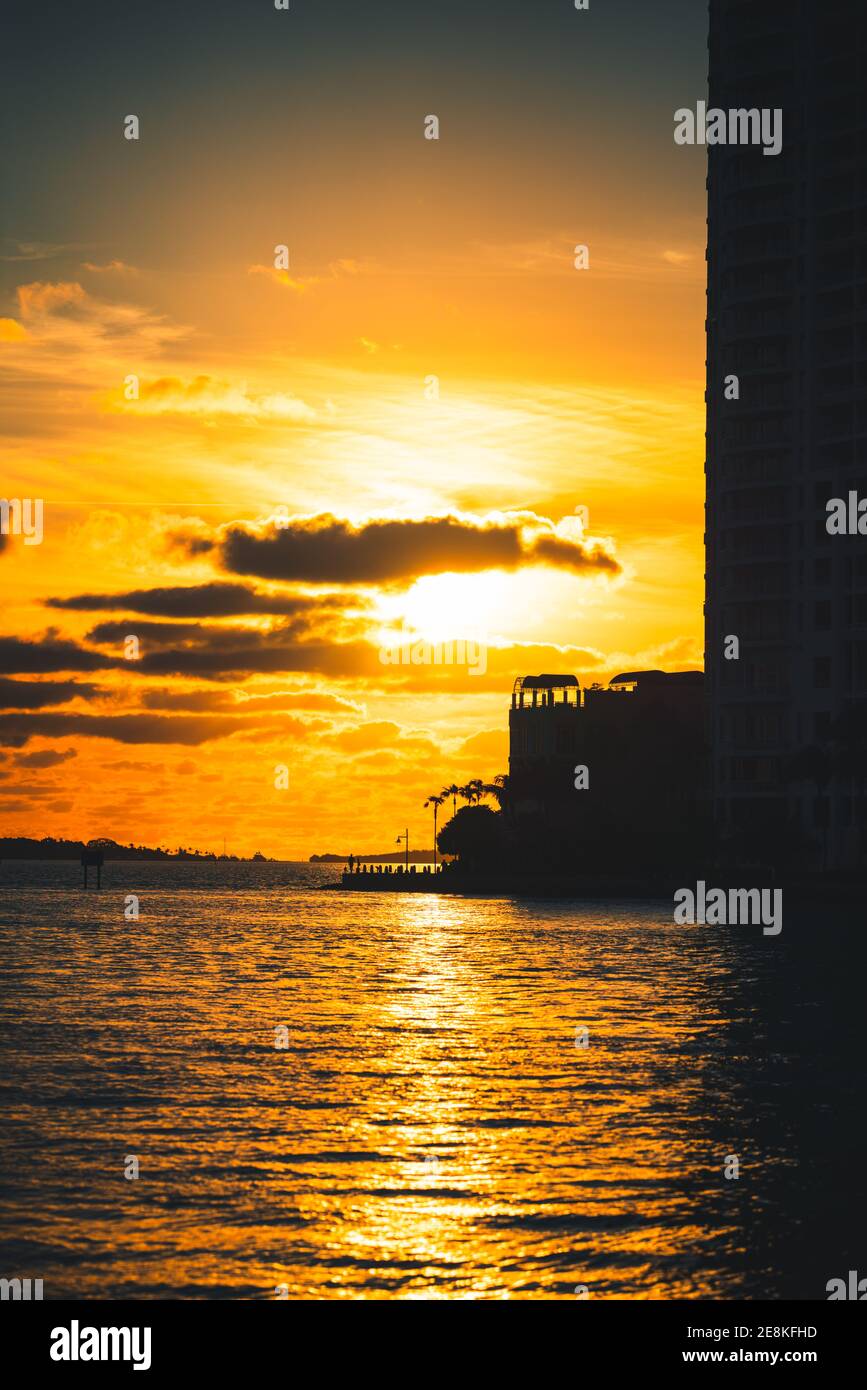 A scenic view of a tall building against a beautiful sunset sky Stock ...
