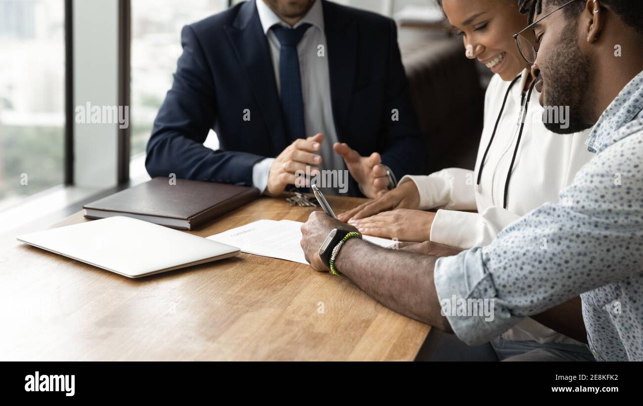 Young black couple buy real estate after getting agent consultation ...