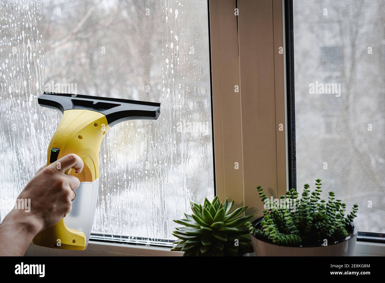 Hand washing and cleaning window with professionally squeegee portable ...