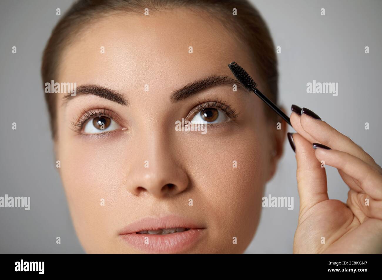 Eyebrows correction. Shape. Beautiful young woman with perfect natural ... Eyebrows correction. Shape. Beautiful young woman with perfect natural ...