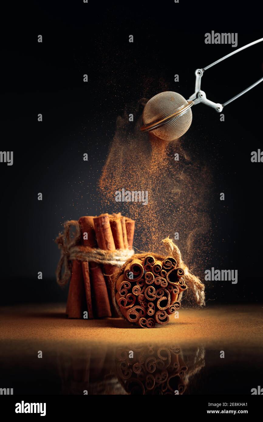 Cinnamon powder is poured out of the strainer. The ground cinnamon ...