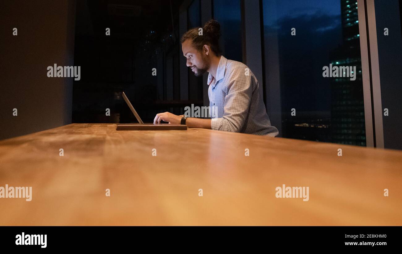 Happy businessman in night office hi-res stock photography and images ...
