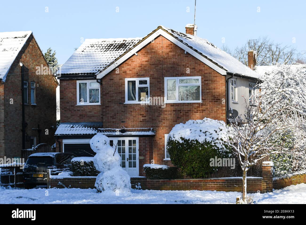 snowman outside a house Stock Photo - Alamy