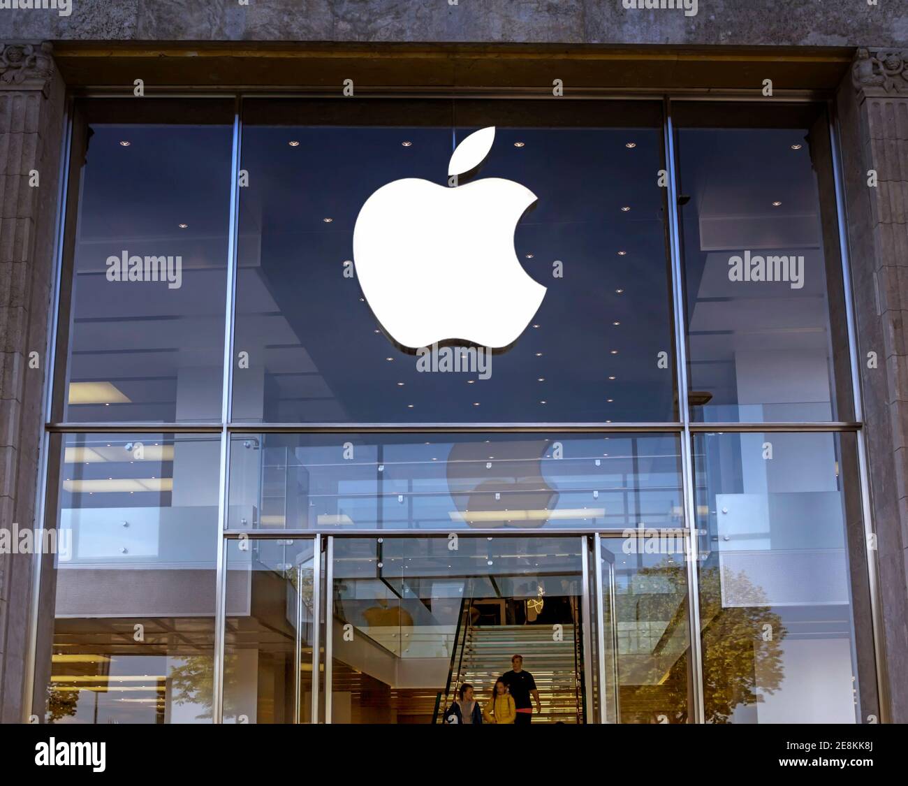 Logo of Apple Inc. on a Apple store. Apple is the multinational ...