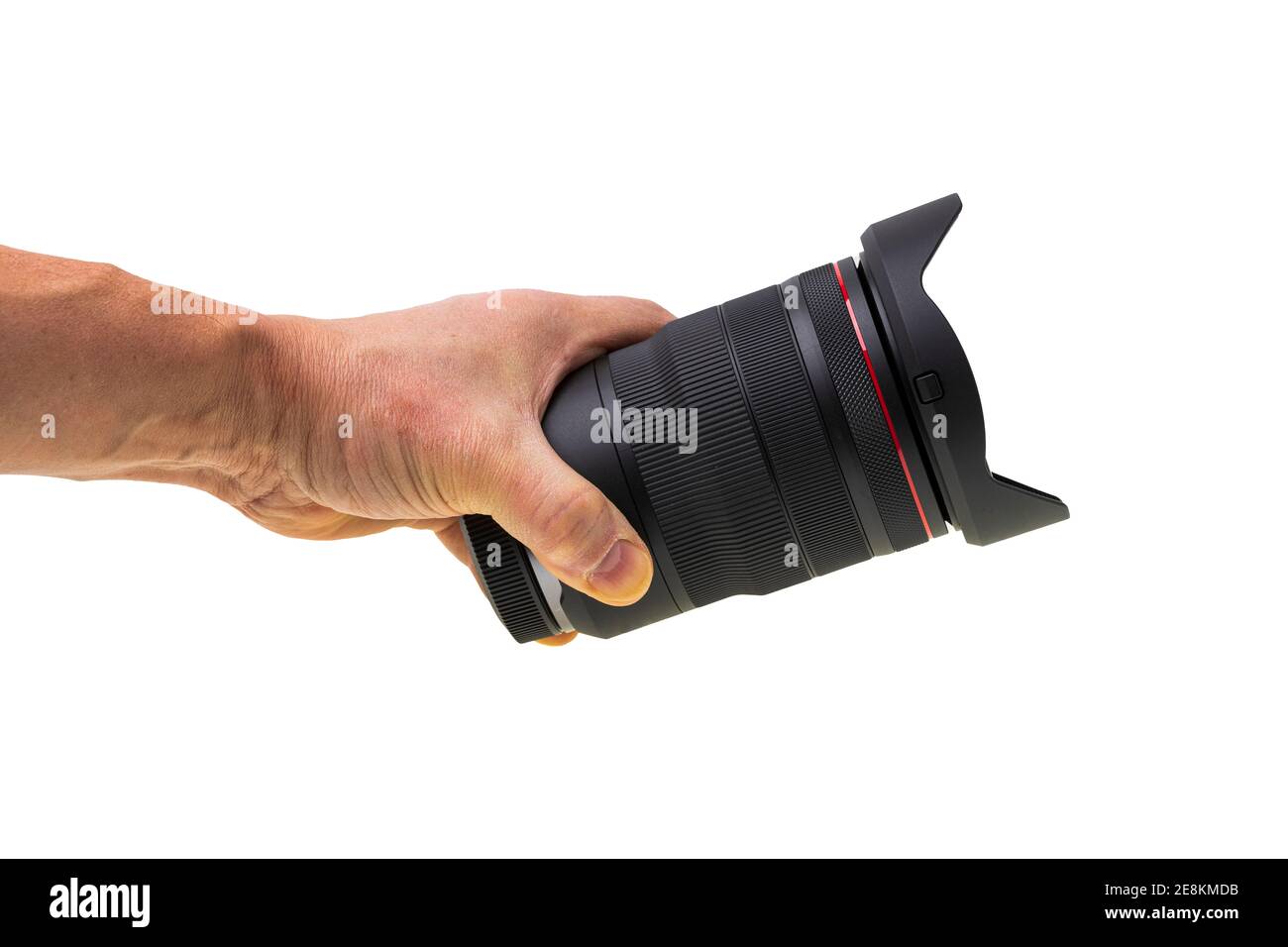 Close up view of male hand holding camera lens isolated on white ...