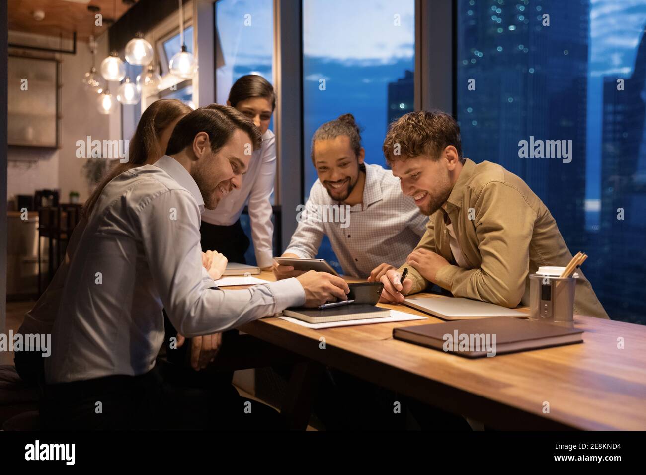 Group of five diverse colleagues have fun at meeting room Stock Photo ...