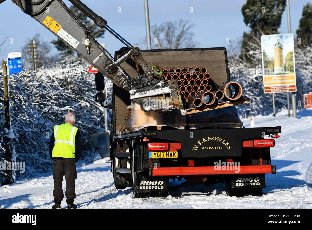 pipes being delivered to a building site Stock Photo - Alamy