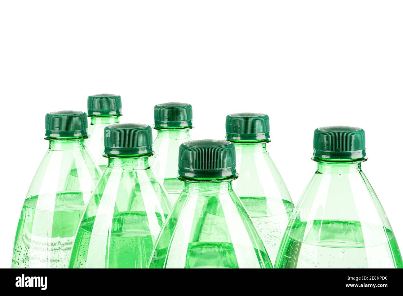 Top of plastic bottles with mineral water on a white background. Close ...
