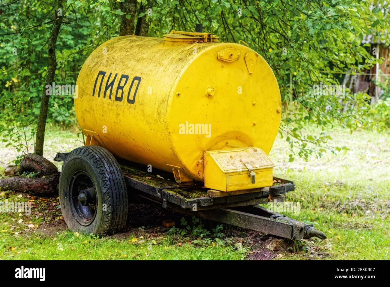 Old barrel-shaped trailer for transportation and sale of from bright ...