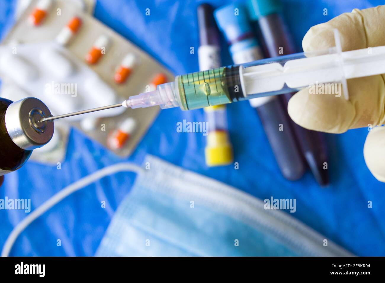 A closeup of a needle in a doctor's hand on an operating table ...