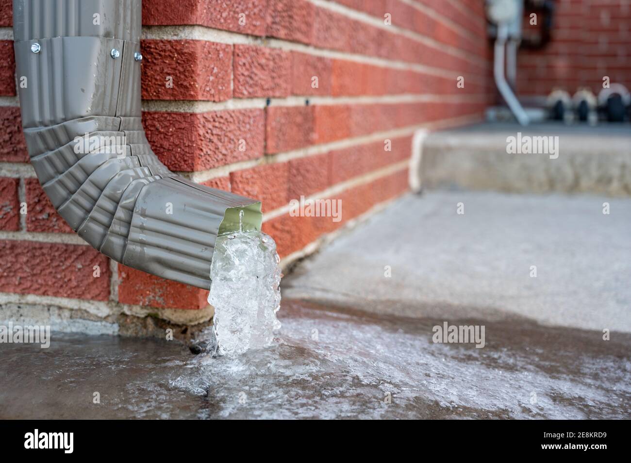 Potential damage to rain gutters from ice blockage Stock Photo - Alamy