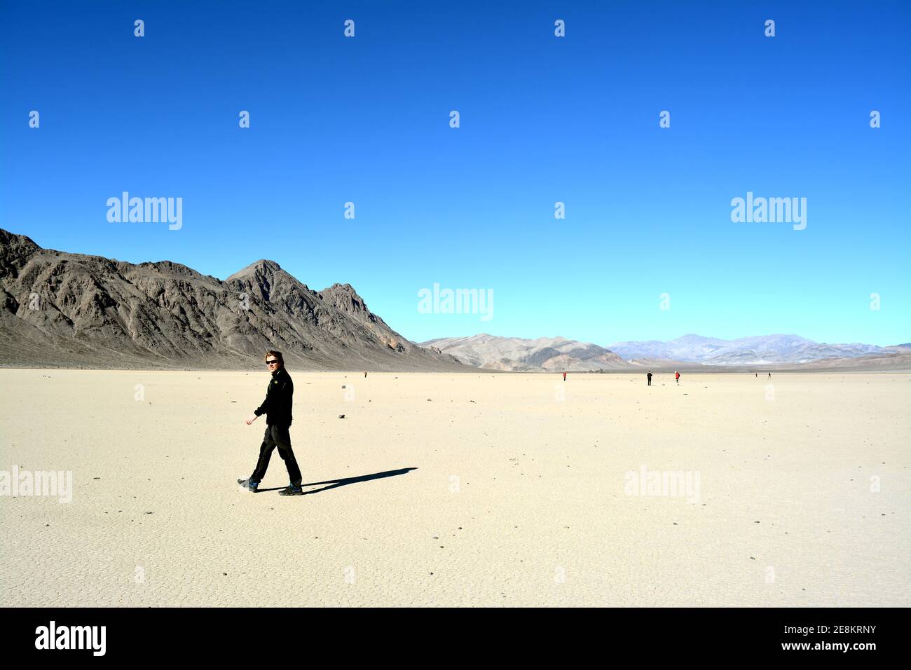 single person standing on the Racetrack Playa in the Death Valley ...