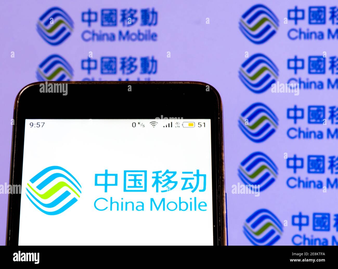 In this photo illustration a China Mobile logo seen displayed on a ...