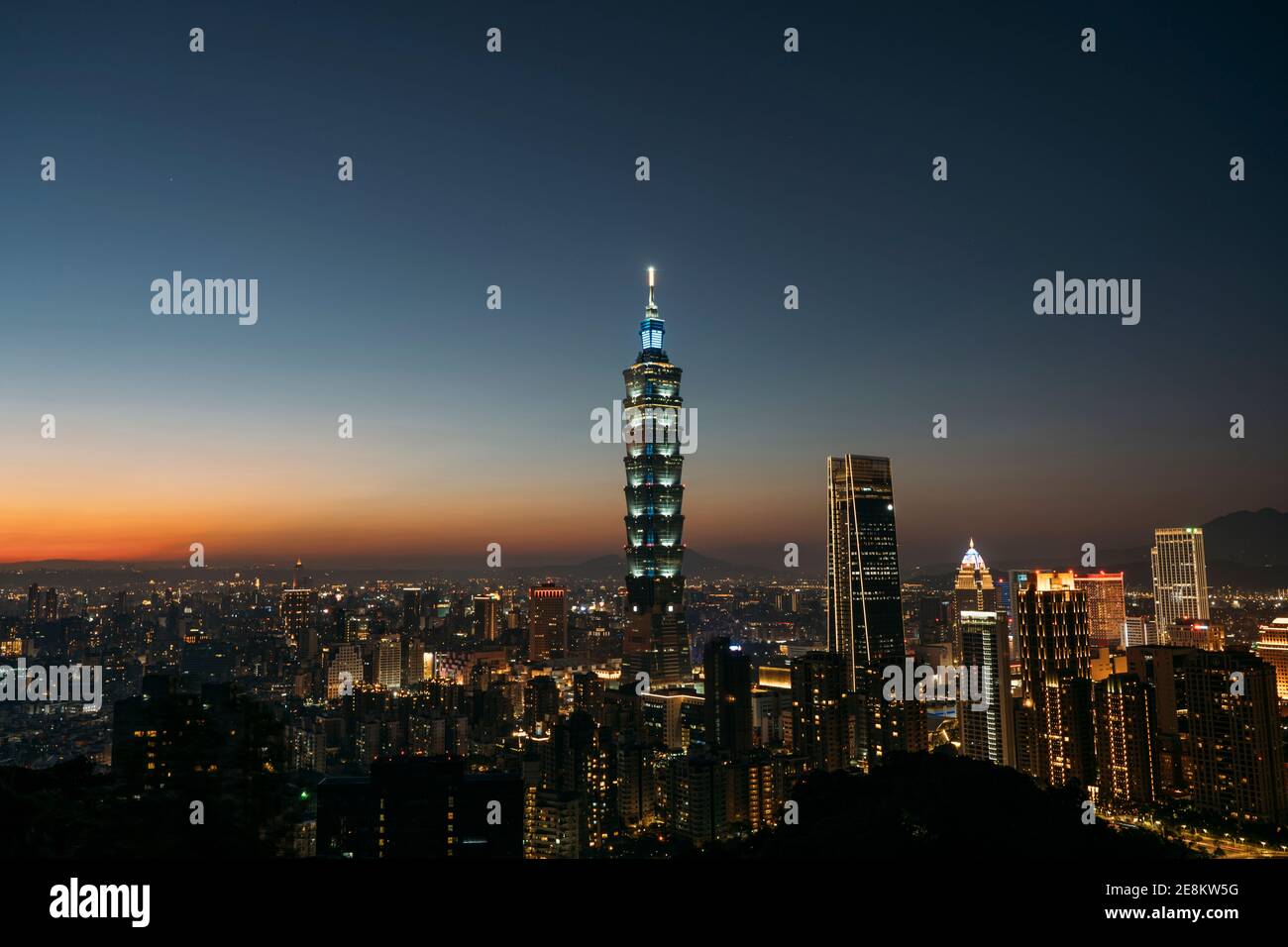 Landscape view of Taipei 101 tower and cityscape at dusk with city ...