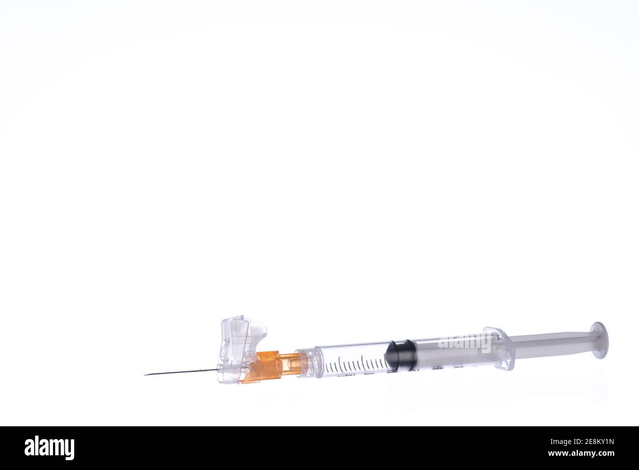 Small syringe isolated on white background Stock Photo - Alamy