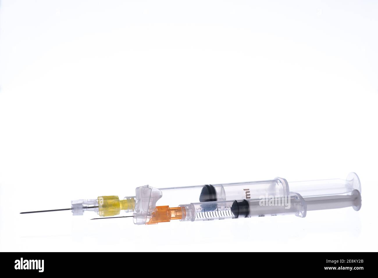 Close up of two syringes on an isolated white background Stock Photo ...