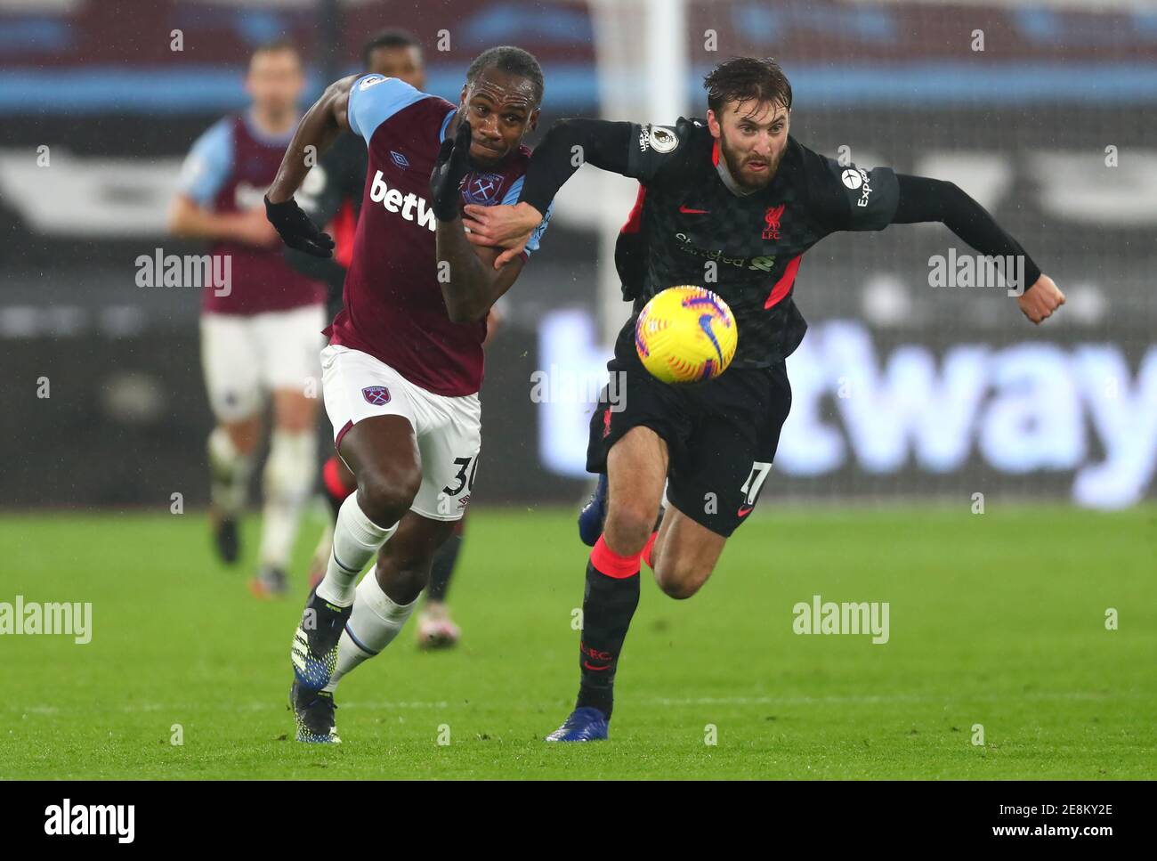 West Ham United's Michail Antonio (left) and Liverpool's Nathaniel ...